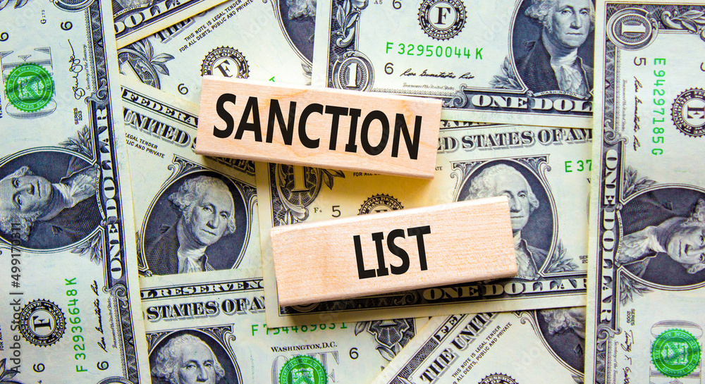 Sanction list symbol. Wooden blocks with concept words Sanction list on ...