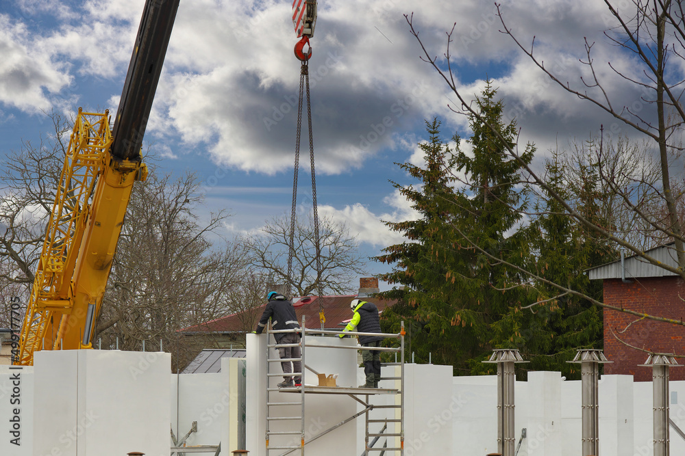 Installation of a panel house with a crane. Construction new and modern ...