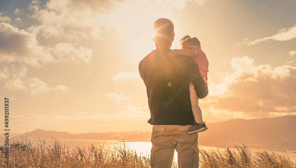 Fatherhood, and single dad concept. Father holding his child looking to ...