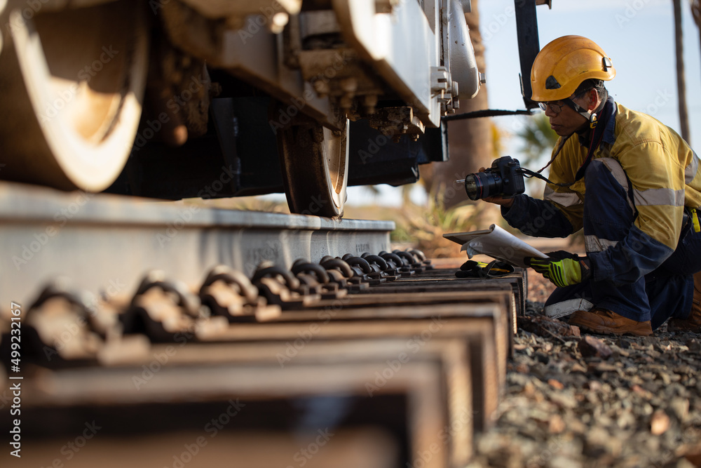 Certified train mechanic maintenance inspector wearing safety helmet ...