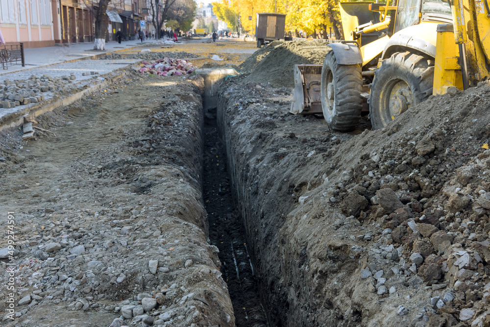 Laying drainage pipes into the ground of underground drainage works ...