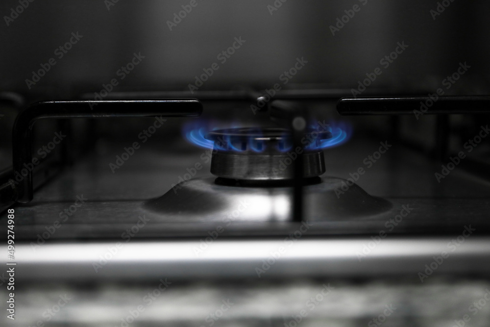 Gas stove, some stoves lit with a match with fire, to cook a good meal ...