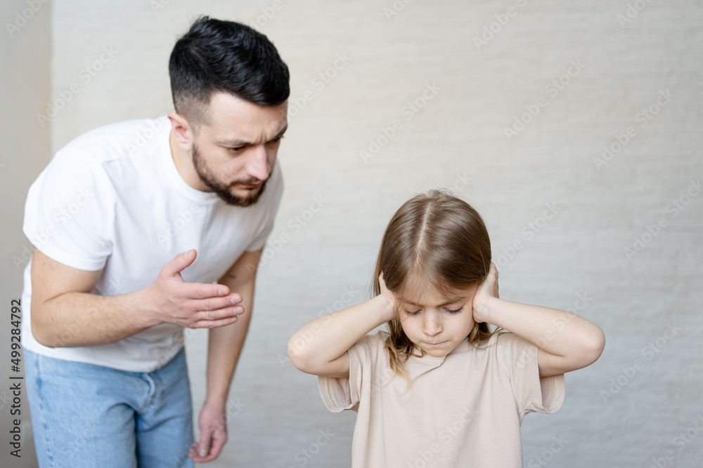 Family conflict. Father and daughter quarrelling at home, sulky child ...
