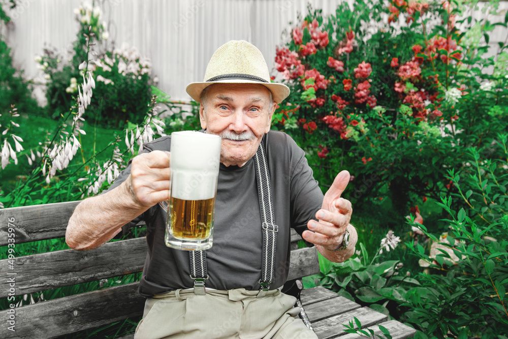 old man with a glass of foamy beer Stock Photo | Adobe Stock