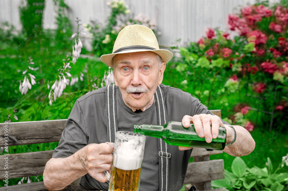 old man with a glass and a bottle of foamy beer Stock Photo | Adobe Stock