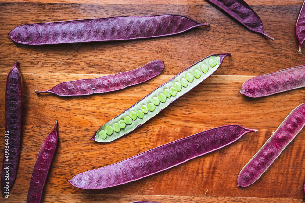 Guaje seed pods are scattered on a wood table in Oaxaca, Mexico. Stock ...
