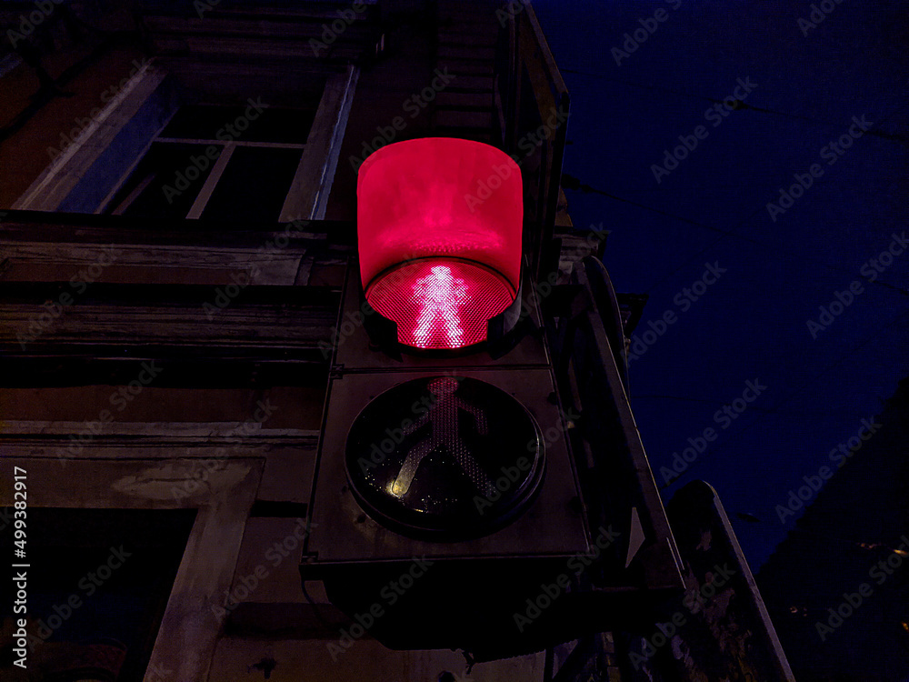 traffic light at night shows the red warning color of the stop. Stock ...
