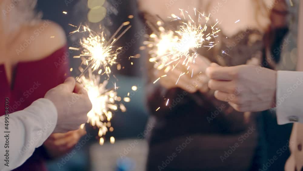 Asian girl and group young college student friends lit light sparkler ...