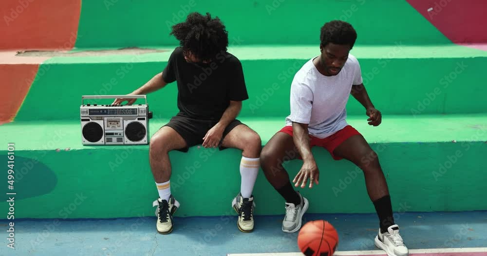 Young african people listening music from vintage boombox stereo ...