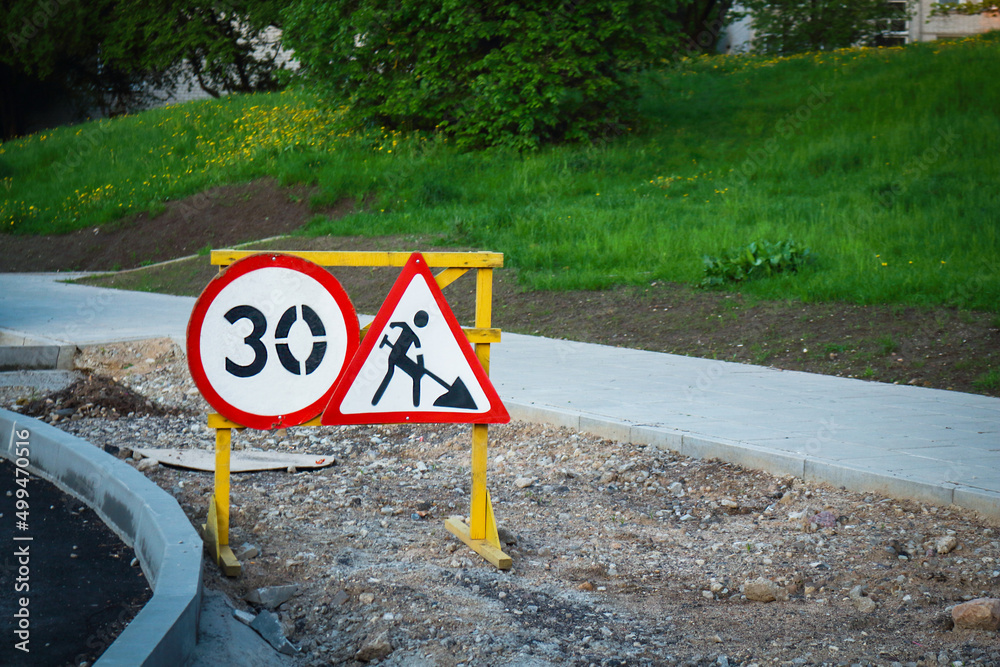 Construction road signs with number and digging man with shovel symbol ...