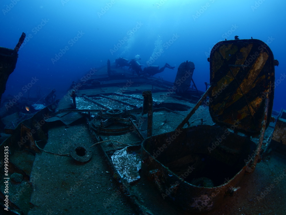 ship wreck underwater deep sea bottom metal on ocean floor scuba divers ...