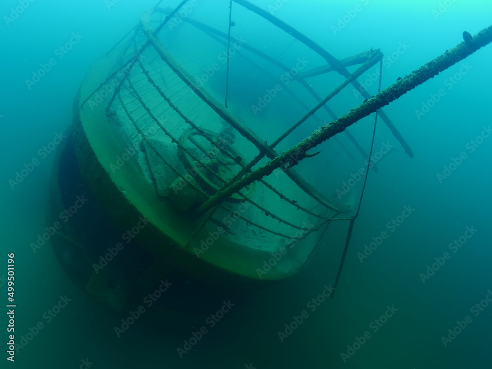 ship wreck underwater deep sea bottom metal on ocean floor scuba divers ...