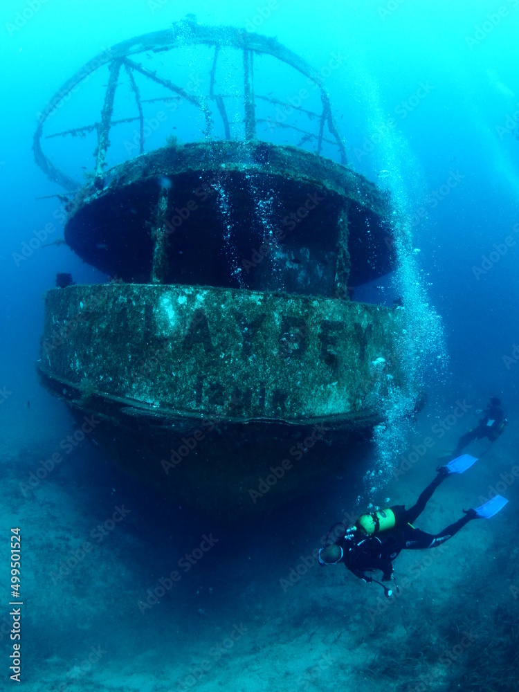 ship wreck underwater deep sea bottom metal on ocean floor scuba divers ...
