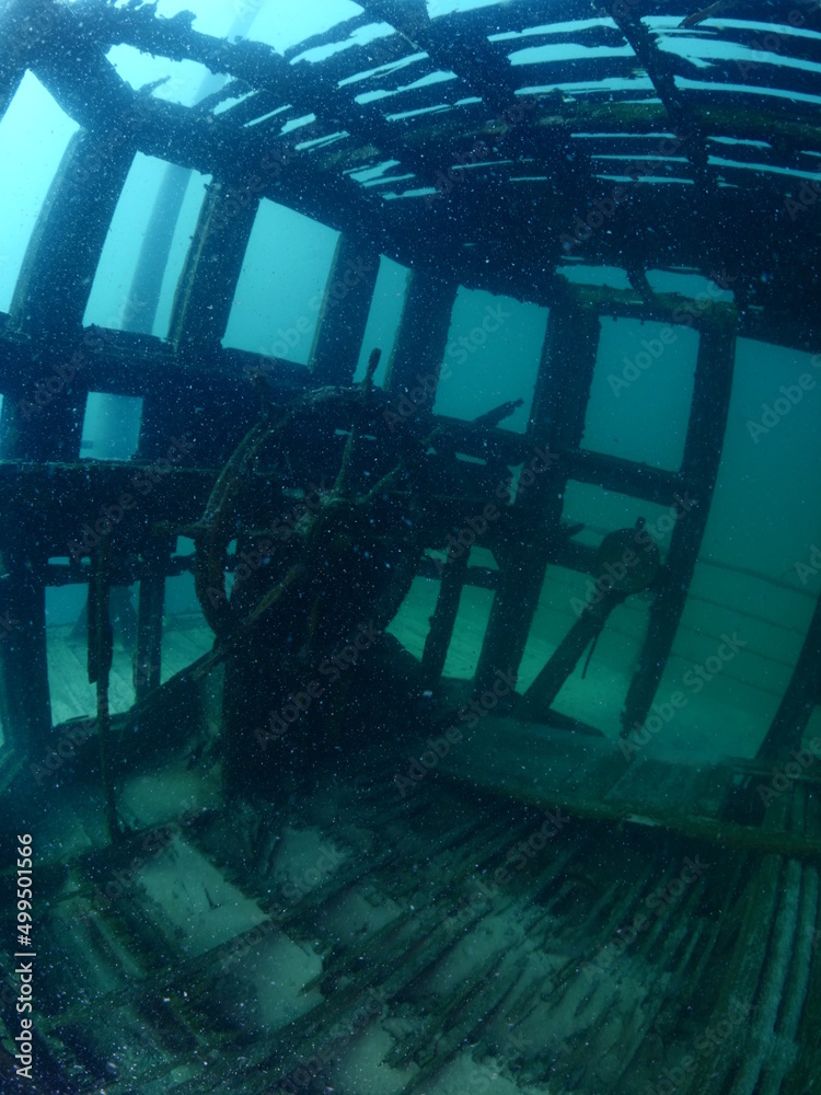 ship wreck underwater deep sea bottom metal on ocean floor scuba divers ...