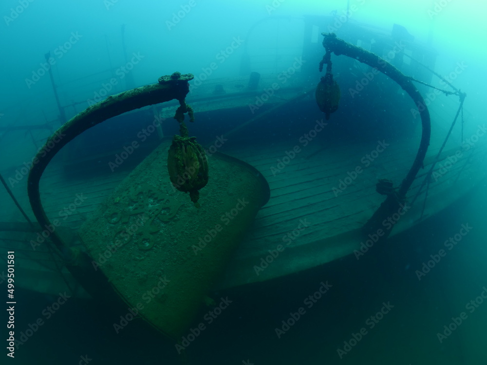 ship wreck underwater deep sea bottom metal on ocean floor scuba divers ...