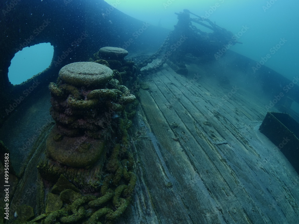 ship wreck underwater deep sea bottom metal on ocean floor scuba divers ...