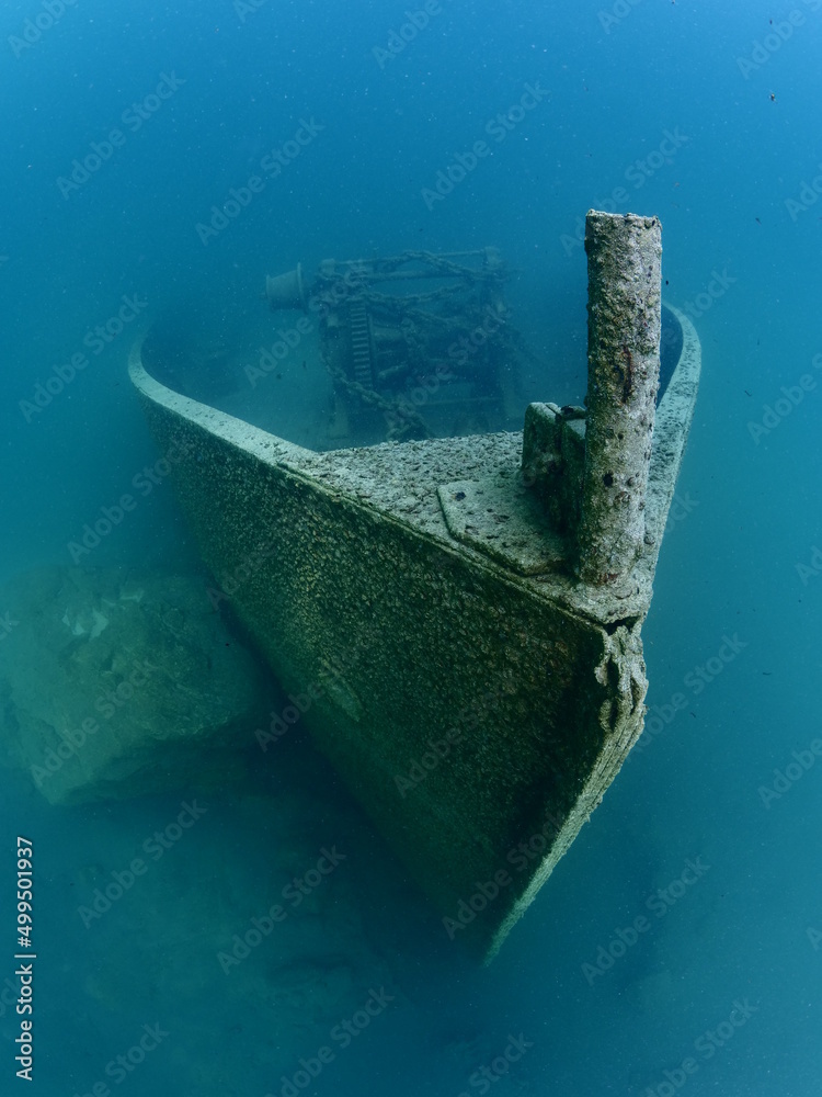 ship wreck underwater deep sea bottom metal on ocean floor scuba divers ...
