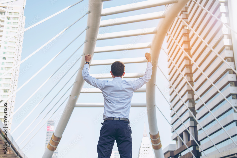 Victory man power holding fist winner positive energy. Back side Man ...