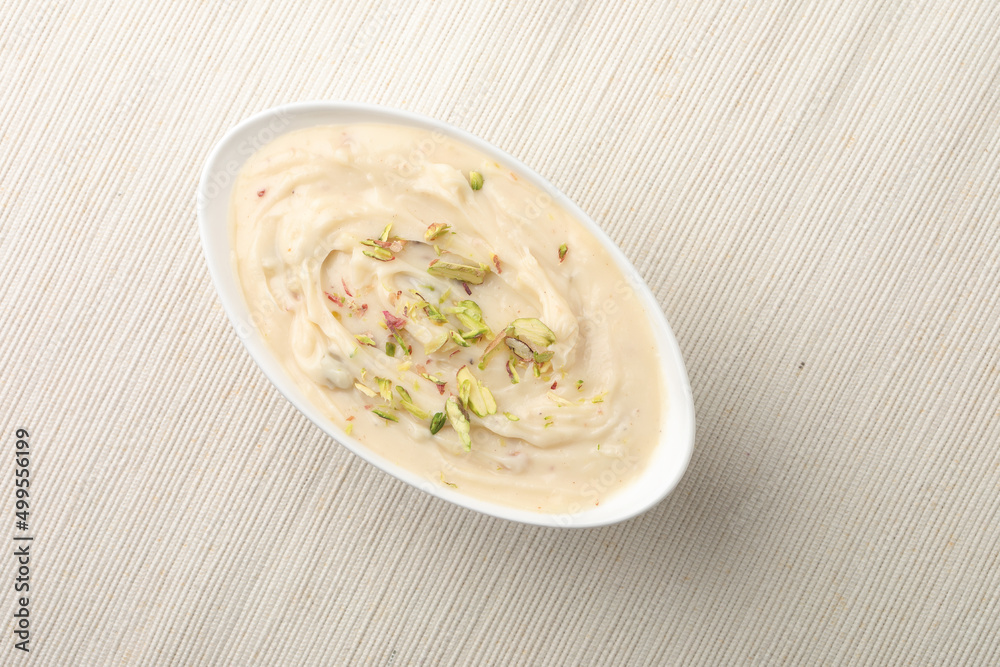 Shrikhand is an Indian sweet dish made of strained curd,garnished with ...