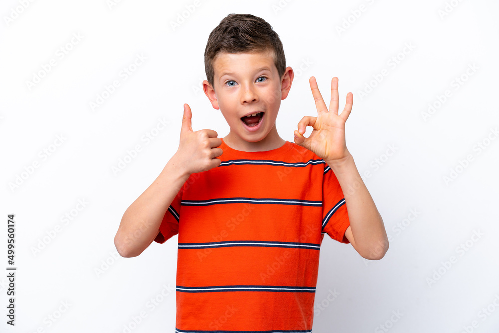 Little boy isolated on white background showing ok sign and thumb up ...