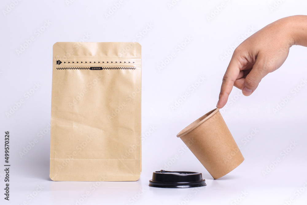 Index finger pointing out paper cup and standing pouch bag with zip ...