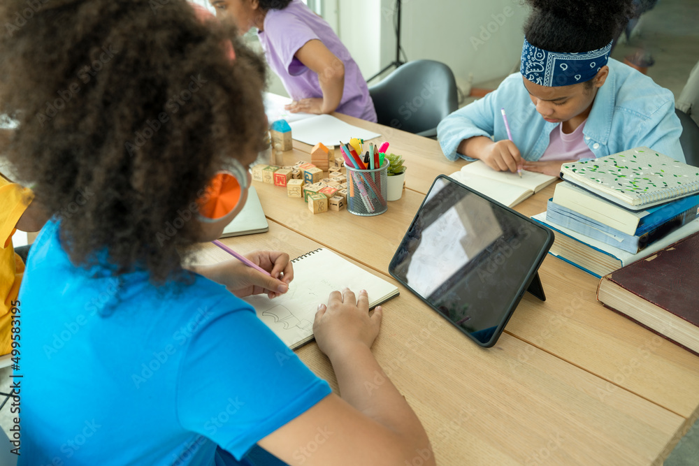 Classroom with Diverse Group of Children Learning New Stuff,African ...