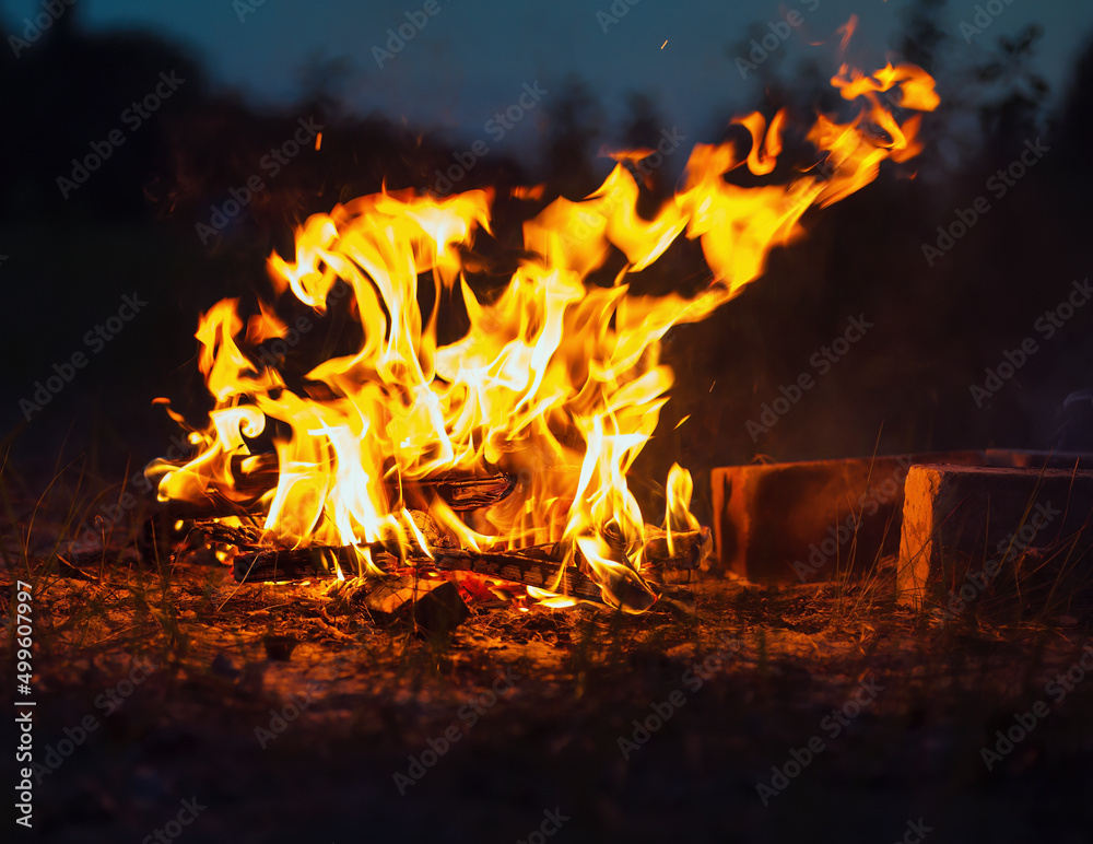 high flame of a bonfire. Fire in night Stock Photo | Adobe Stock