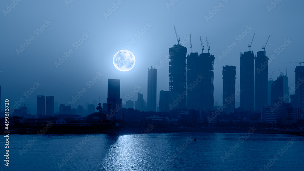 Modern highrise rich buildings and poor slums at night - Mumbai, india ...