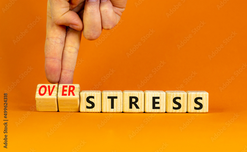 Over stress symbol. Psychologist turns wooden cubes and changes the ...