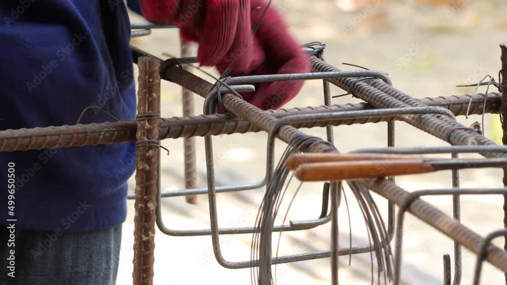 Construction worker fabricating steel reinforcement bar at the ...