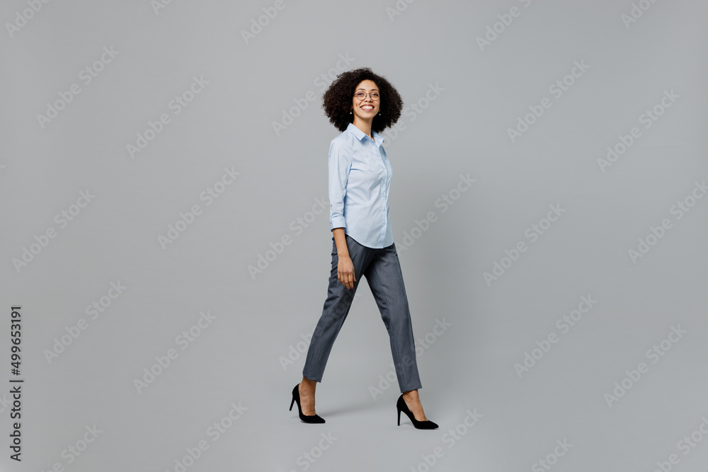 Full body side view smiling fun young employee business corporate lawyer woman of African ...