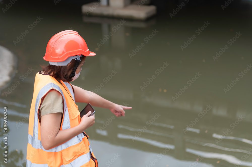Asian Female engineering working . at sewage treatment plant,Marine ...