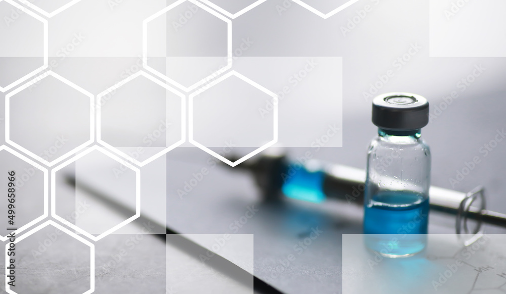 small jars with injection and syringe for injection on a blue ...
