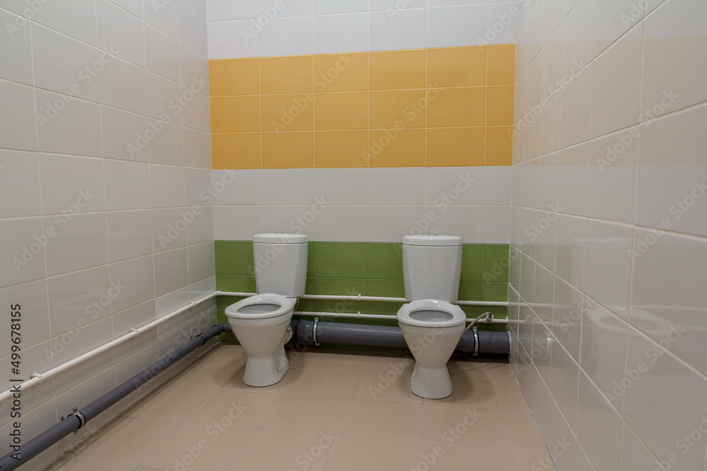 Toilet in the kindergarten. Small toilets for kids in a kindergarten ...