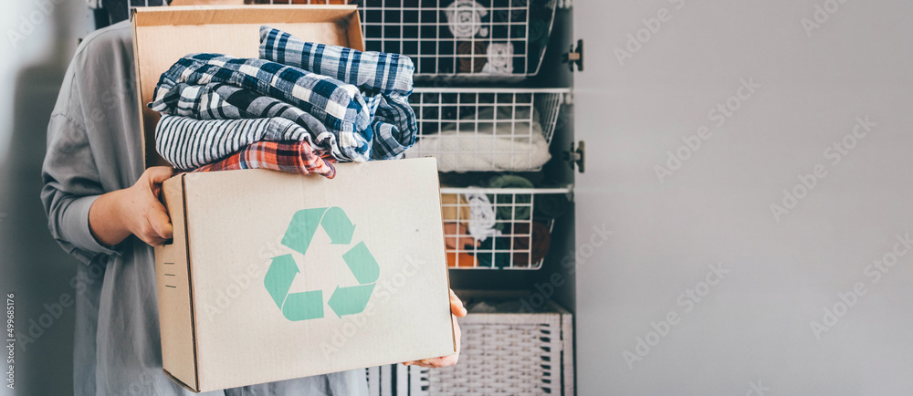Recycle clothes concept. Recycling box full of clothes. Stock Photo ...