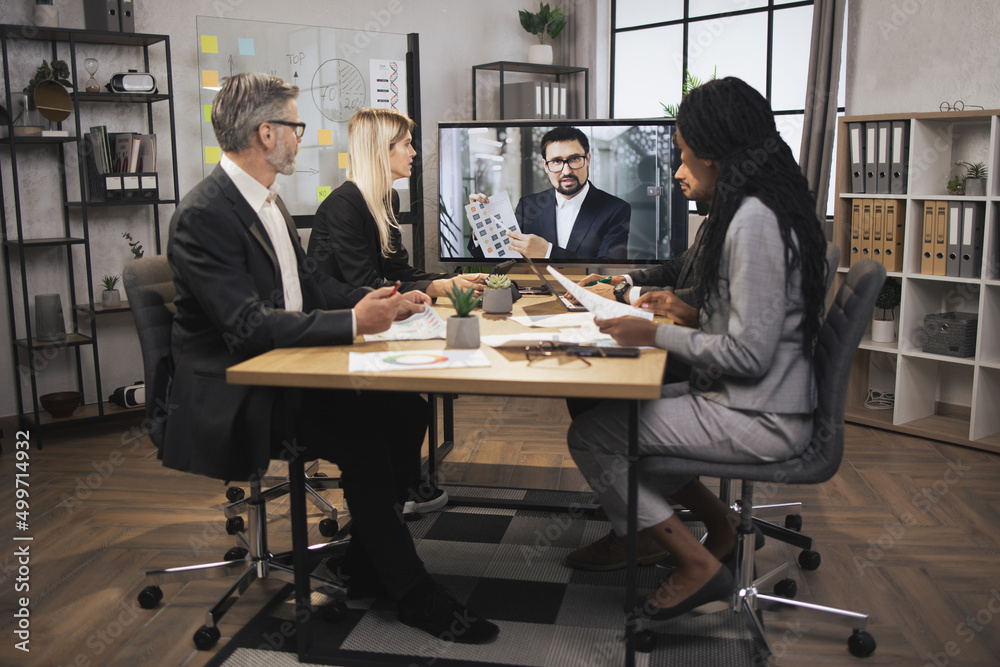 Confident middle-aged bearded Caucasian man tells business program ...