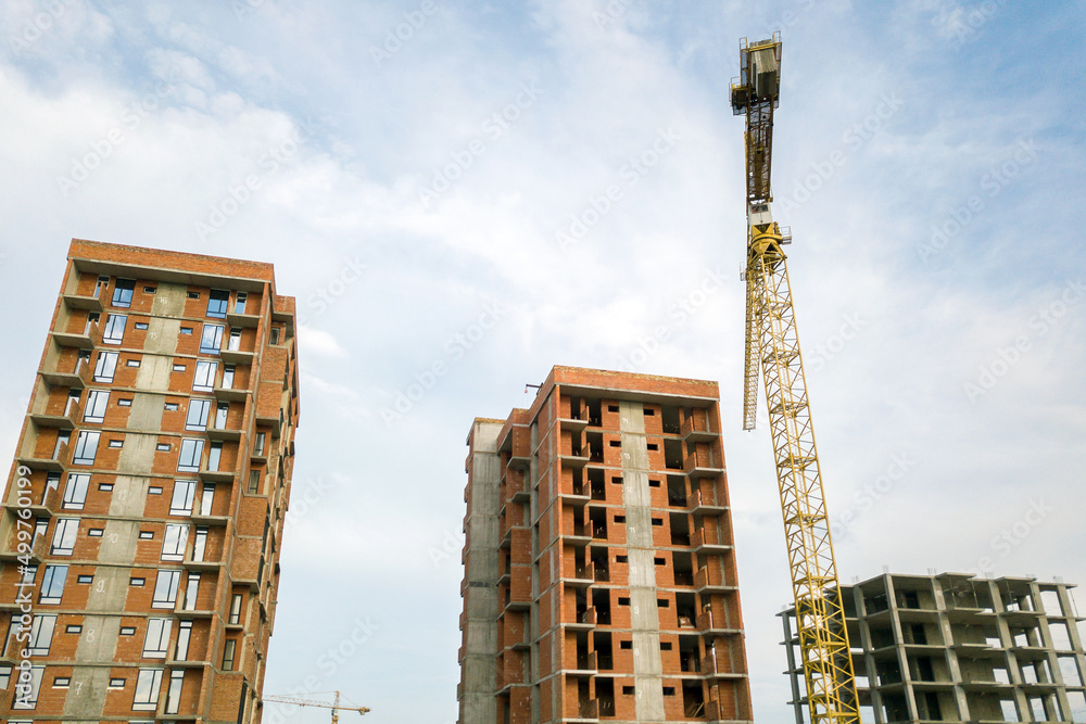 High-rise residential apartment buildings and tower crane under ...