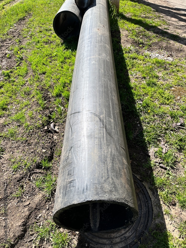 Two empty plastic water supply pipes will be laid in the trench ...