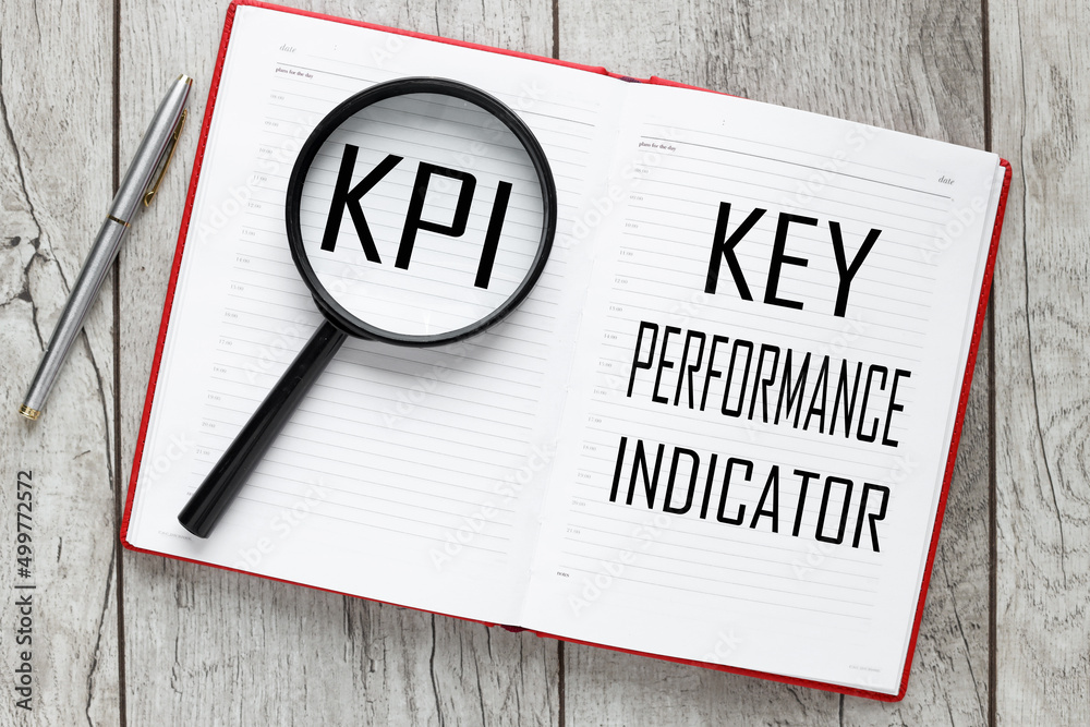 KPI, Key Performance Indicator.text on a glass of a magnifying glass on ...