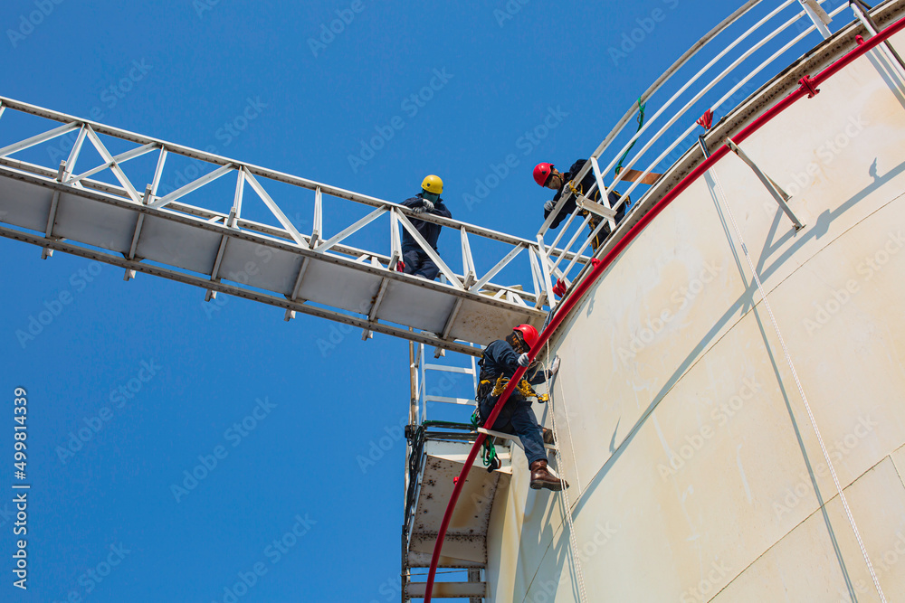 Top view pic of industrial rope access welder working at height wearing ...