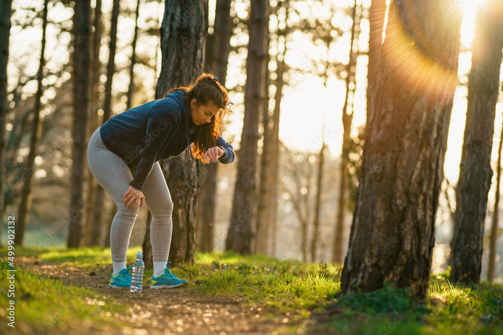 Tired after running. The beautiful curvy woman is resting after running ...