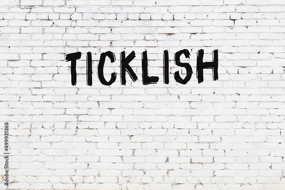 Inscription ticklish painted on white brick wall Stock Illustration ...