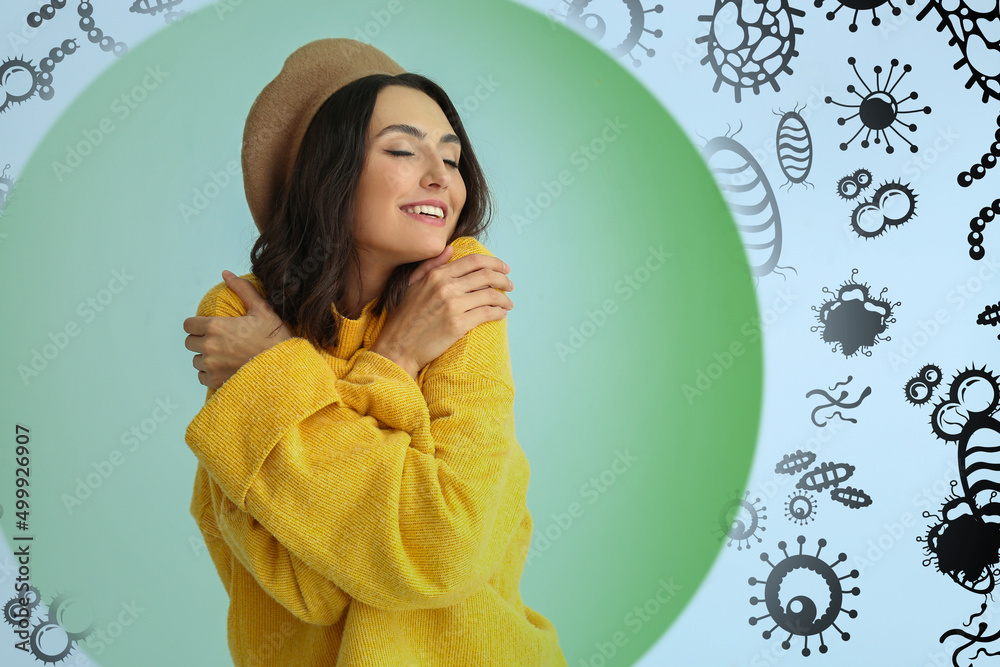 Beautiful young woman with strong immunity on color background ...