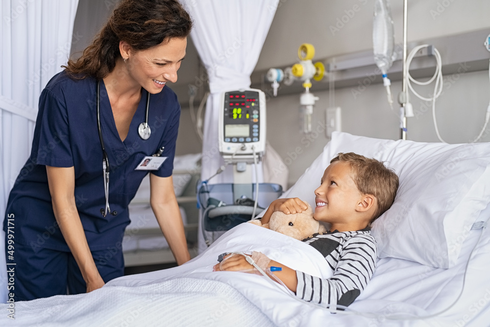 Nurse caring cute little boy patient at hospital Stock Photo | Adobe Stock