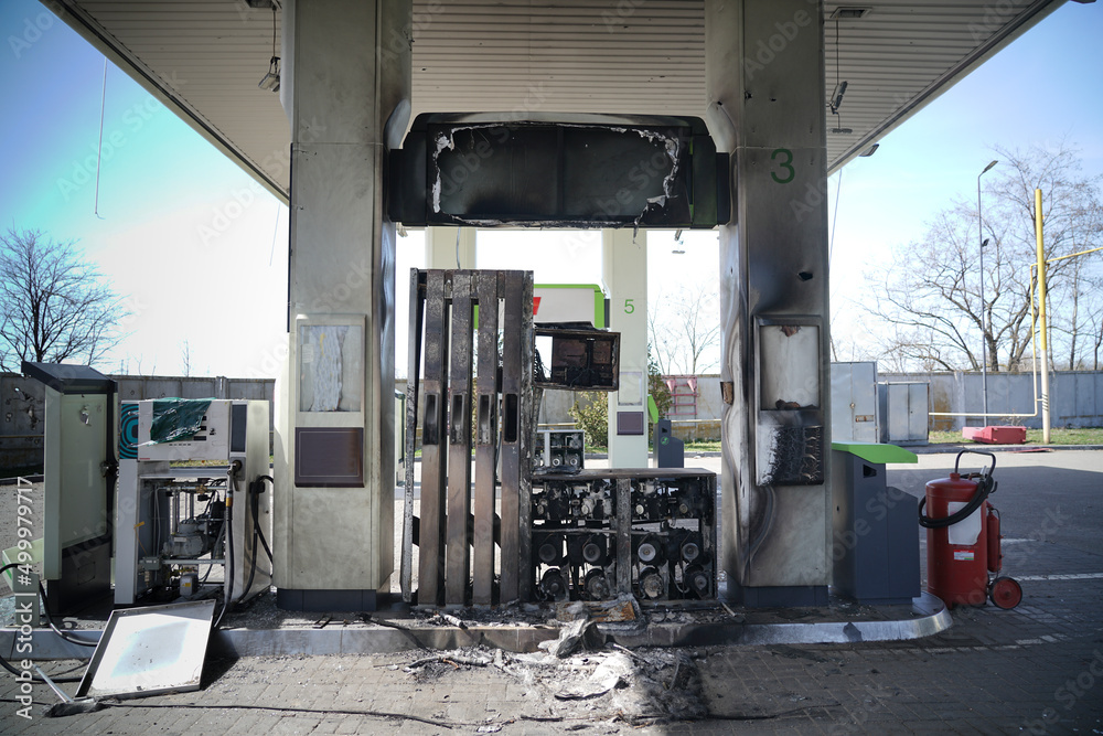 Gas station with a broken station from a shell explosion. Exploded gas ...