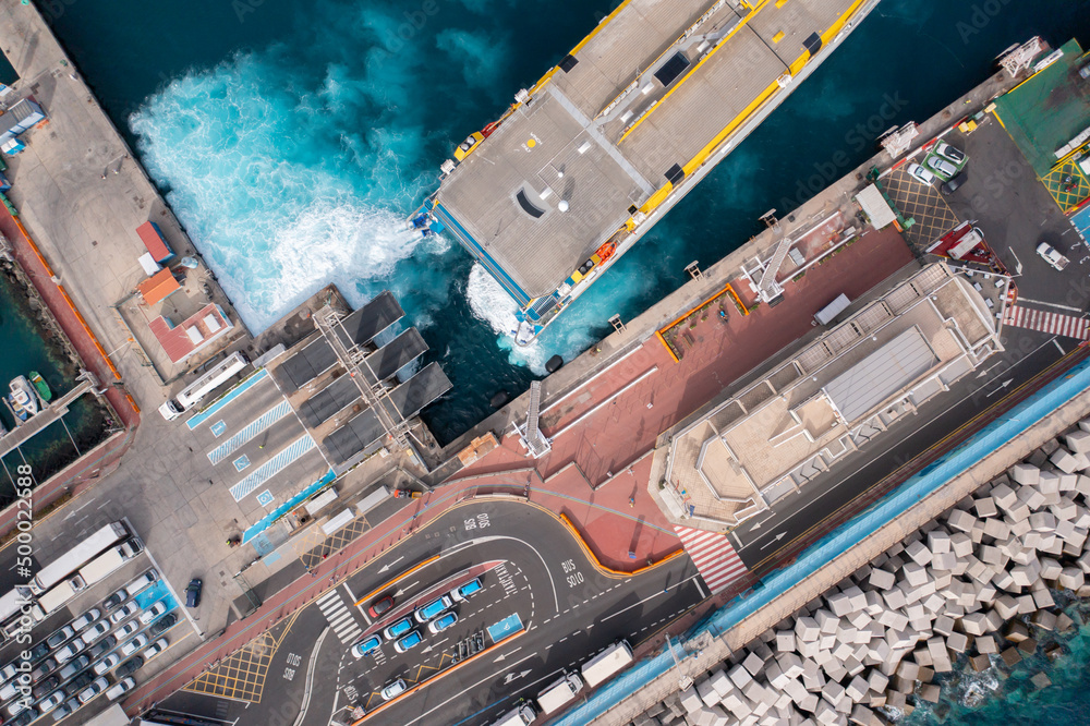 Modern passenger catamaran ship docking in port for loading and ...