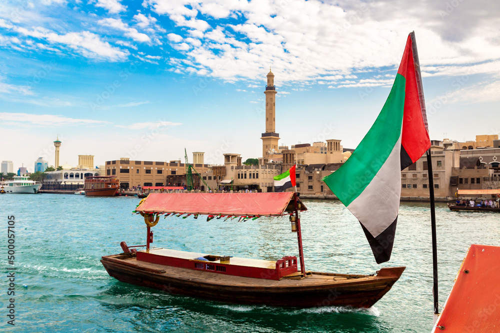 UAE flag and Abra boat in Dubai Stock Photo | Adobe Stock