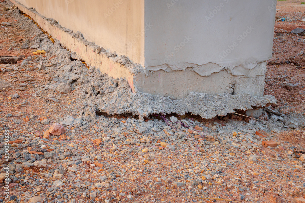 The soil collapsed on the side of the building wall. The ground ...