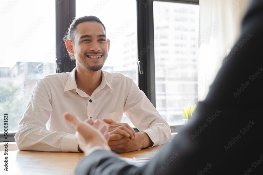interviewer on the table asking question applicant in the office. Stock ...