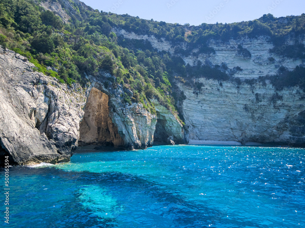 Beautiful view of the blue cave of Paxos island. The purest water with ...